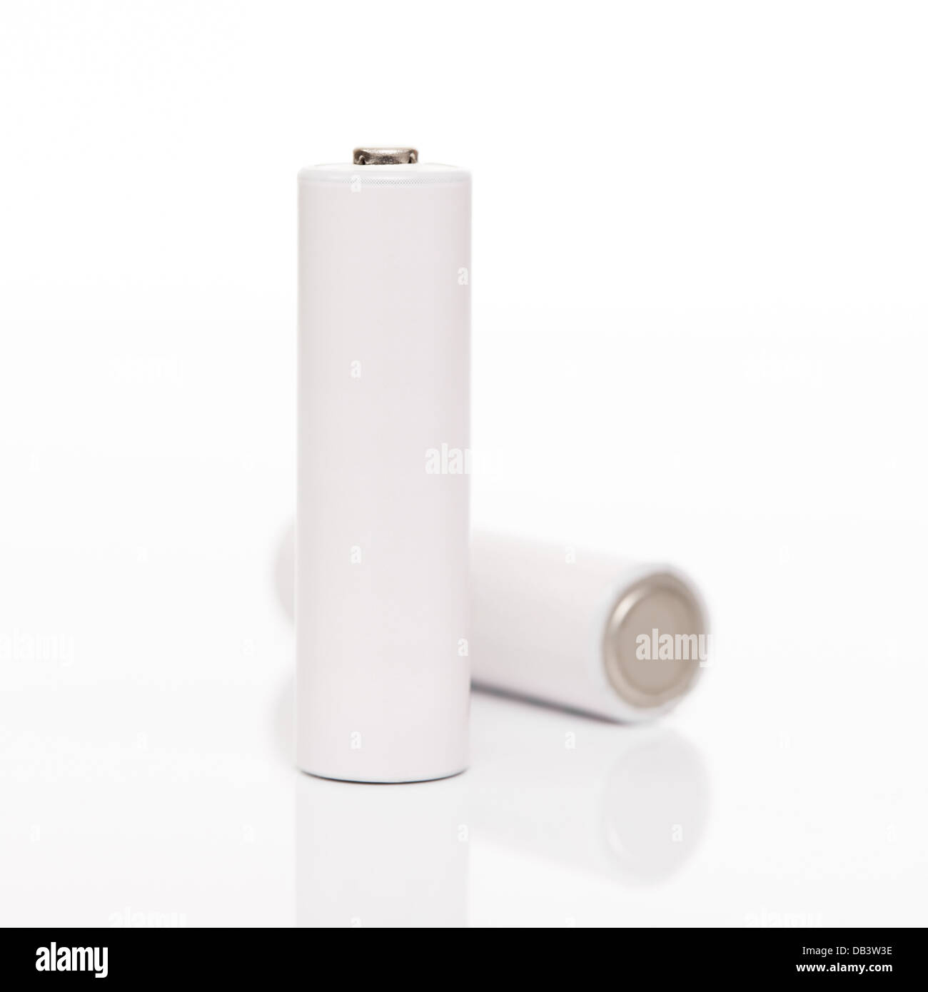 Two white AA batteries isolated on white background Stock Photo - Alamy