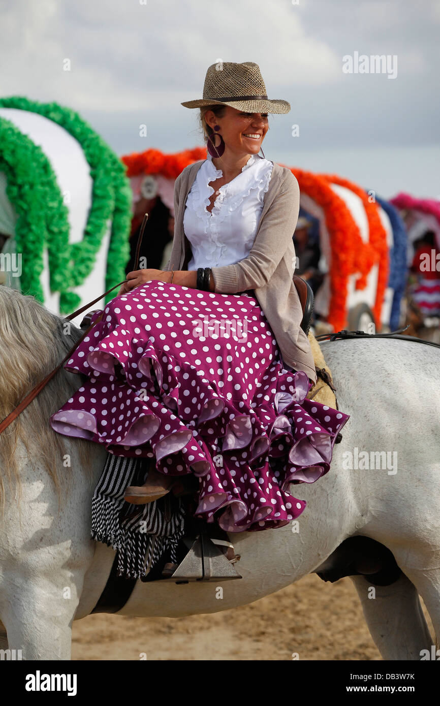 Female Catholic pilgrim wearing gypsy Flamenco style dresses traveling ...