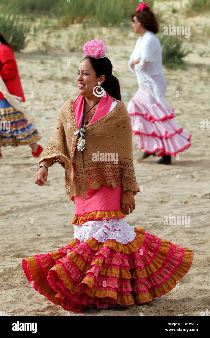 Female Catholic pilgrims wearing gypsy Flamenco style dresses traveling ...