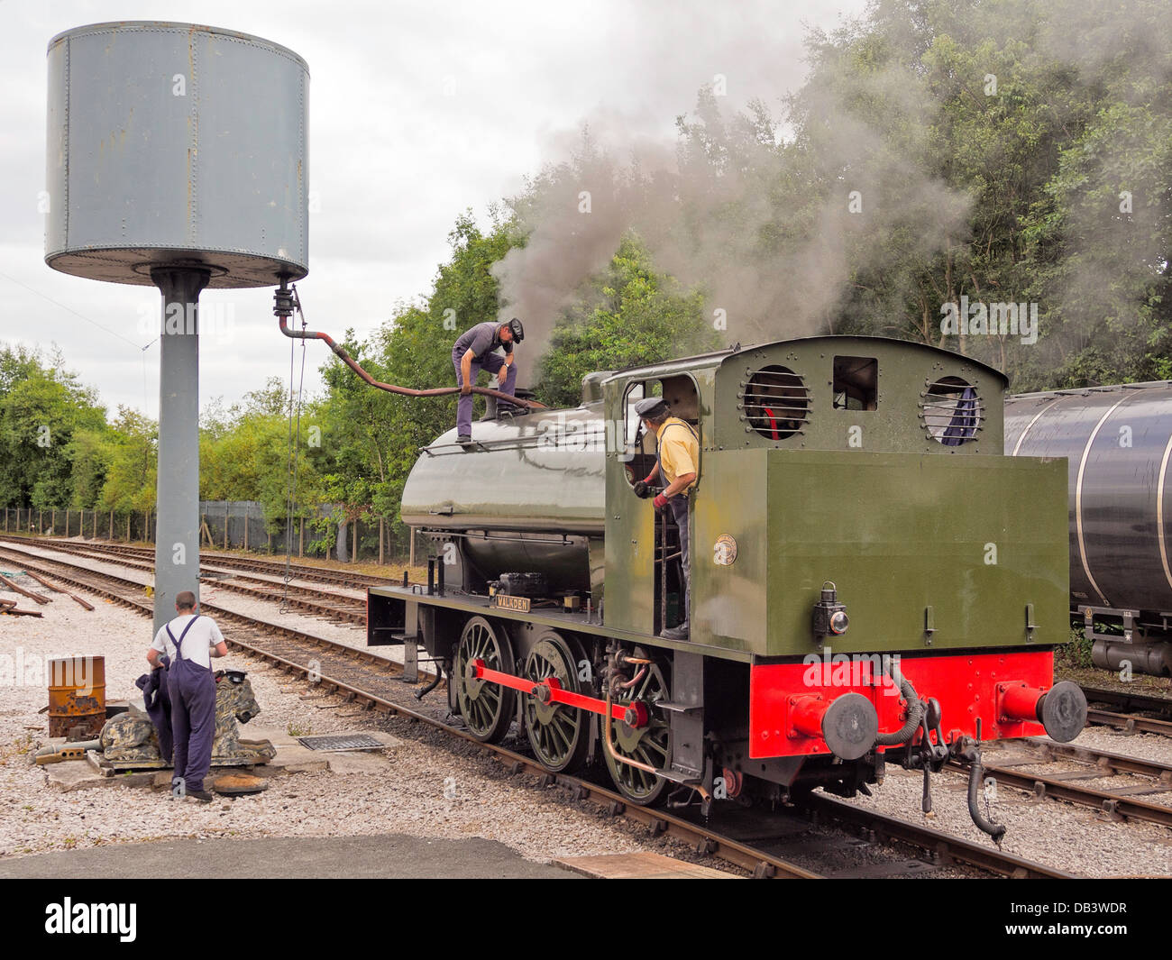 Steam engine drivers taking on water from water tower at Preston Steam ...