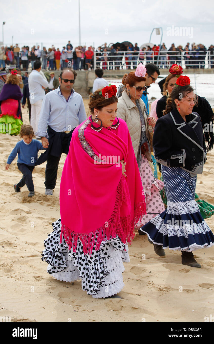 Female Catholic pilgrims wearing gypsy Flamenco style dresses traveling ...
