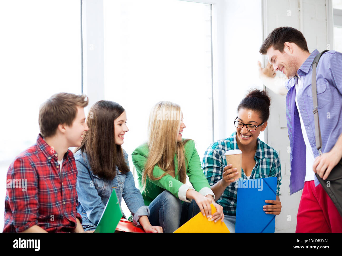 students communicating and laughing at school Stock Photo - Alamy