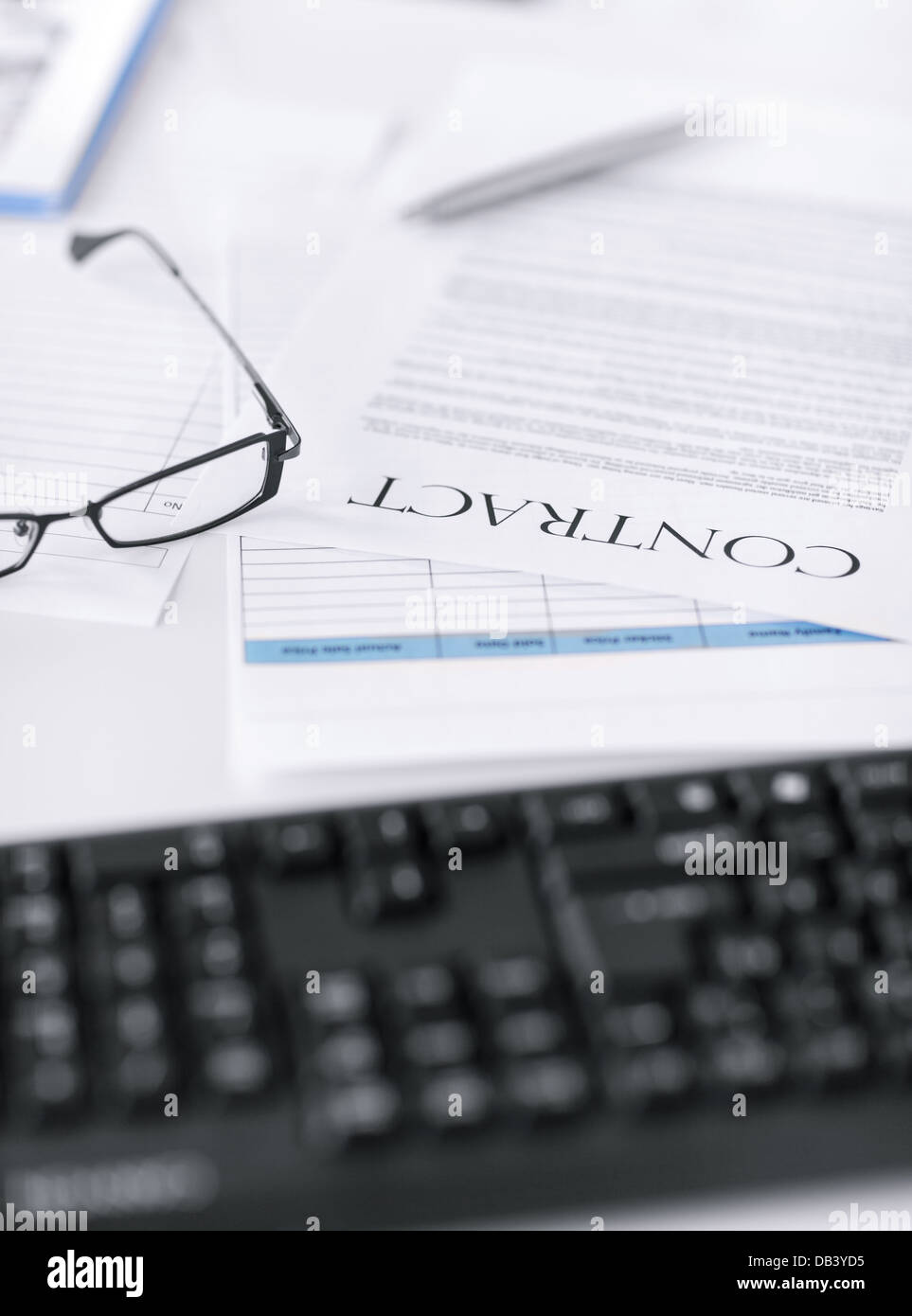 signed contract paper with glasses Stock Photo - Alamy