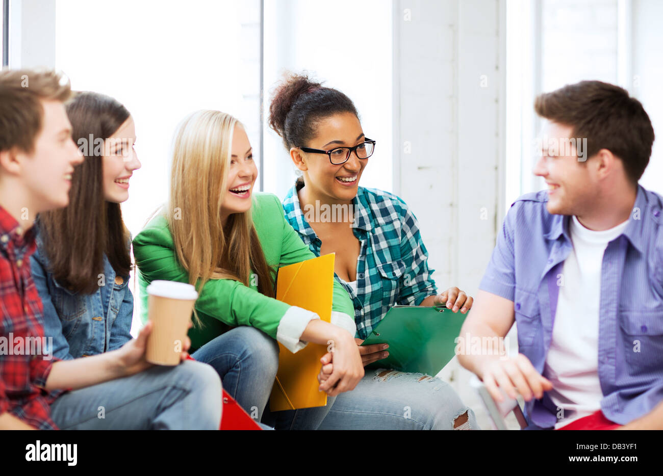 students communicating and laughing at school Stock Photo - Alamy