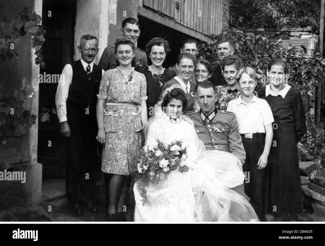 Bridal Couple With Family And Guests Stock Photos & Bridal Couple With ...