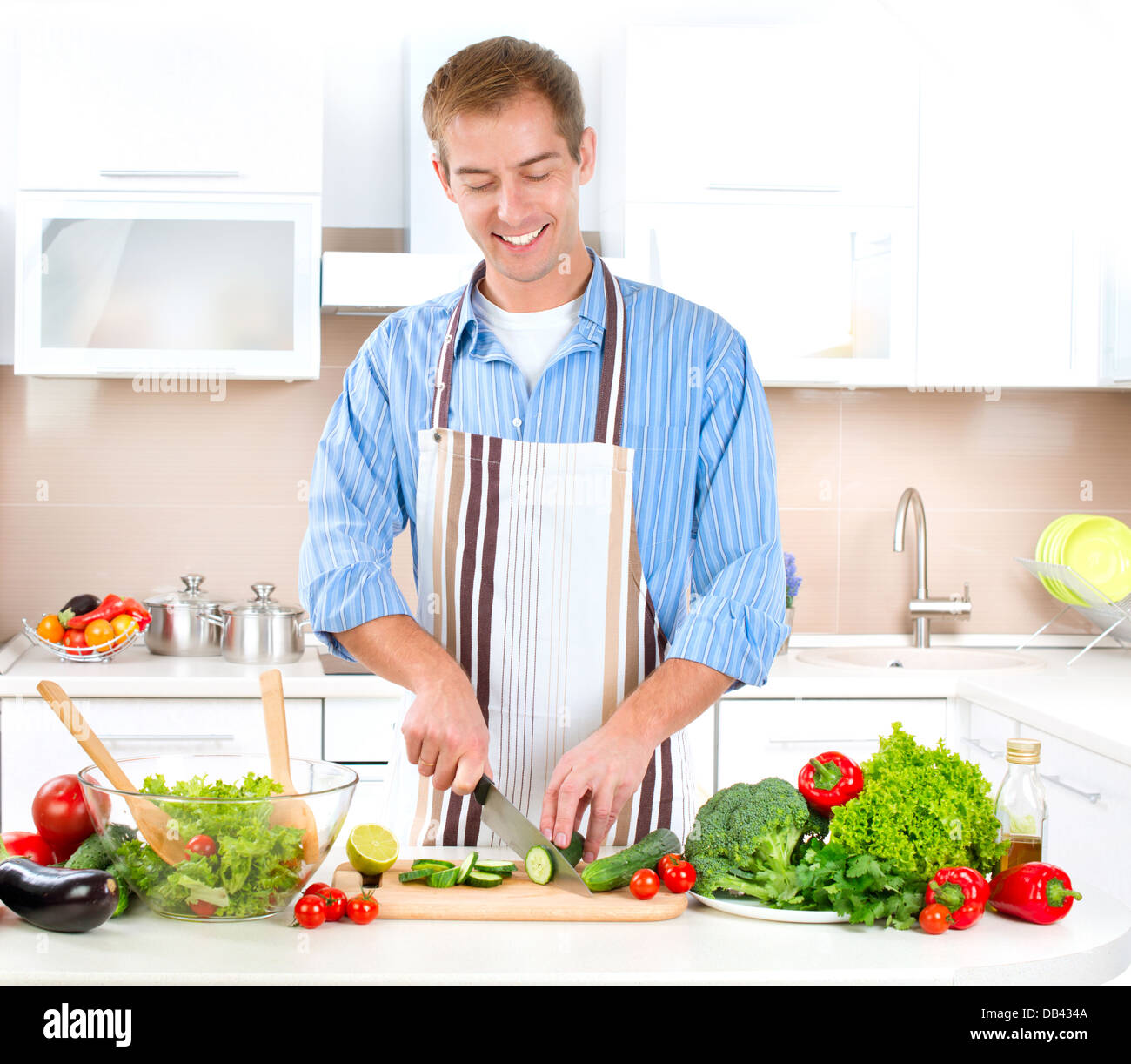 Young Man Cooking. Healthy Food Stock Photo - Alamy