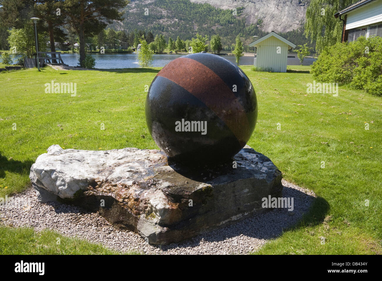 Treungen Telemark Norway Europe Ball shaped sculpture on green in front ...