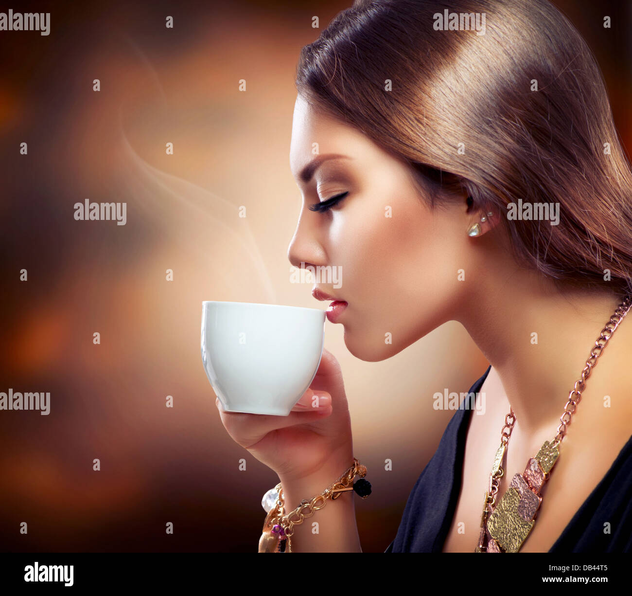Beautiful Girl Drinking Tea or Coffee Stock Photo - Alamy