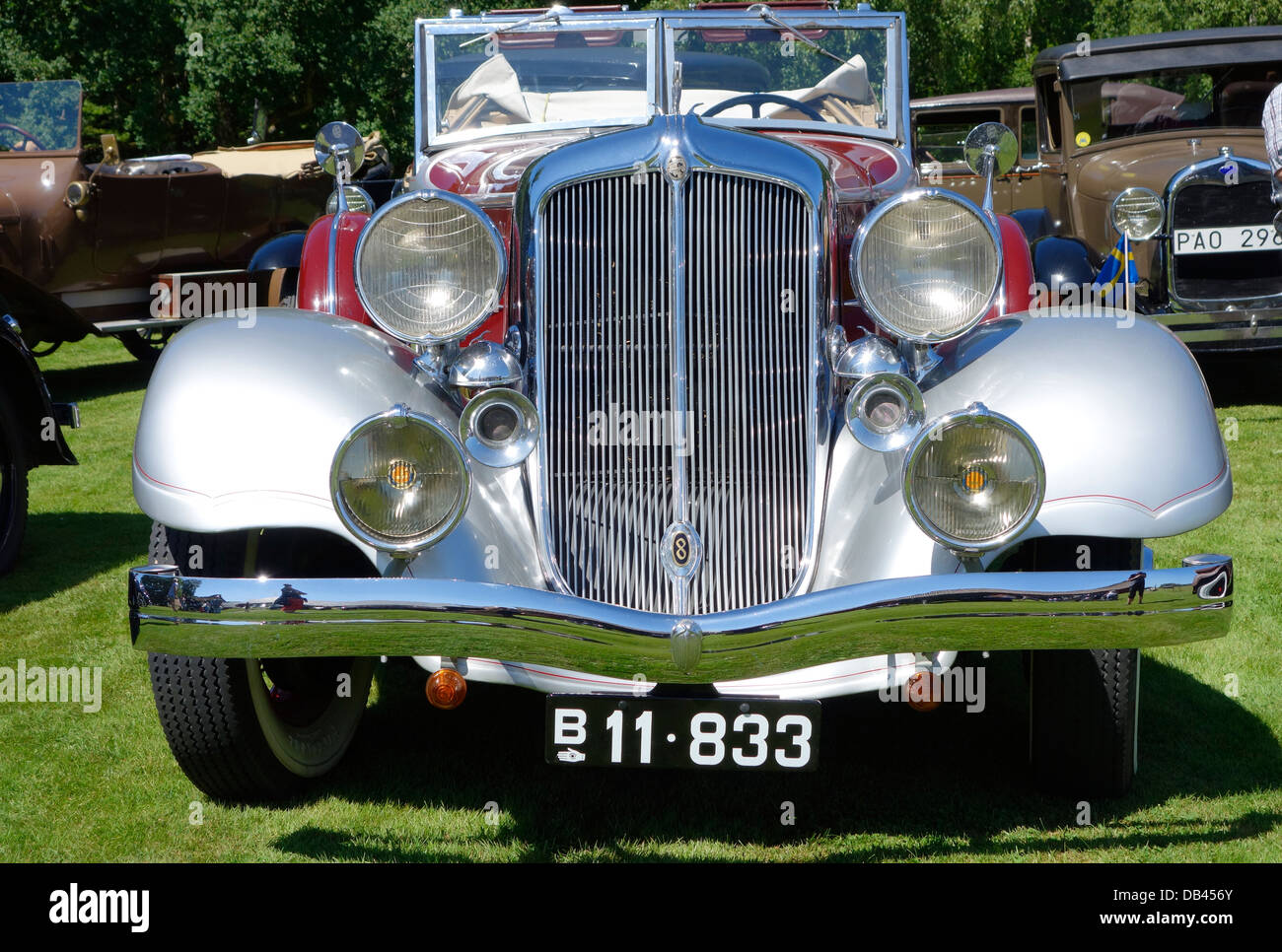 Front view on grills and headlights of antique convertible automobile ...