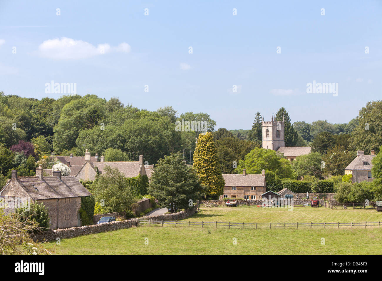 The Cotswold village of Naunton and the tower of St Andrew's Church ...