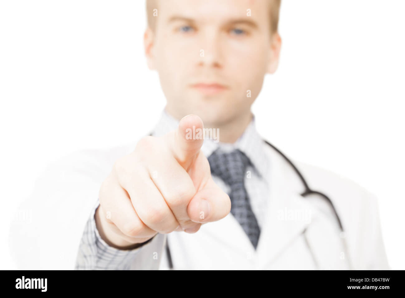 Male doctor on white background pointing his index finger toward viewer ...