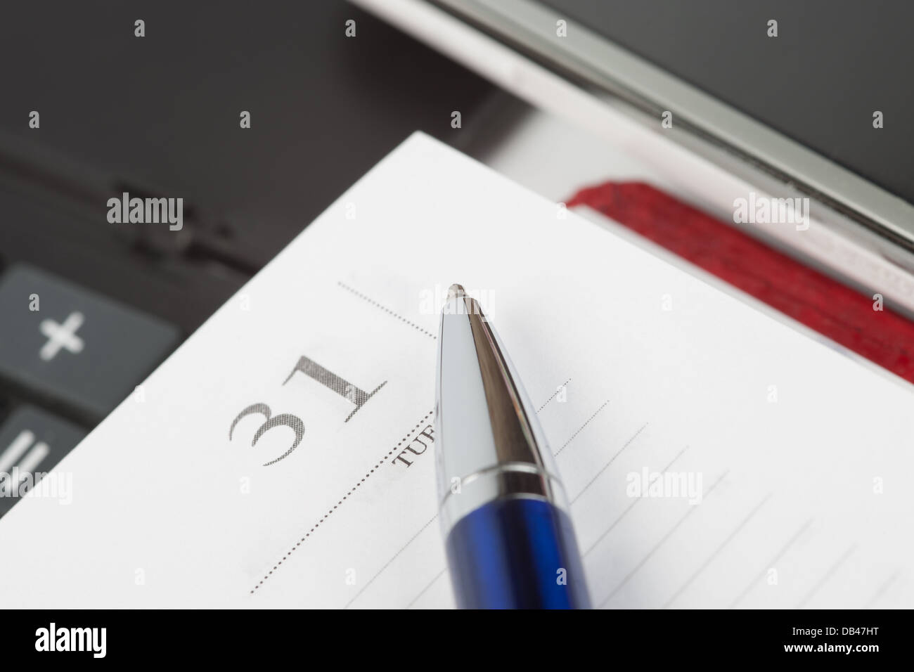 Pen on notebook page Stock Photo - Alamy