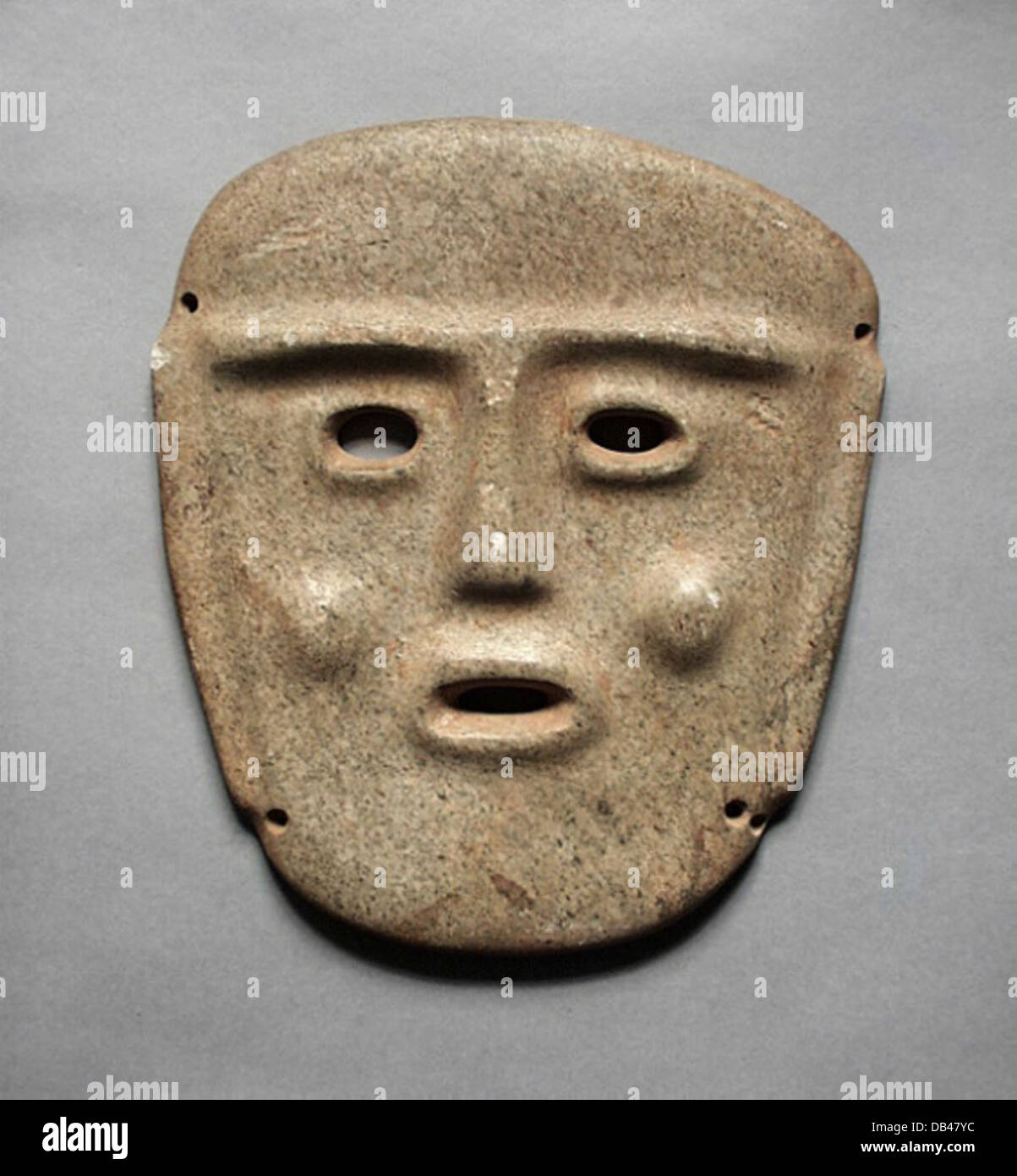 This bronze mask is an example of ancient craftsmanship. It was cast ...