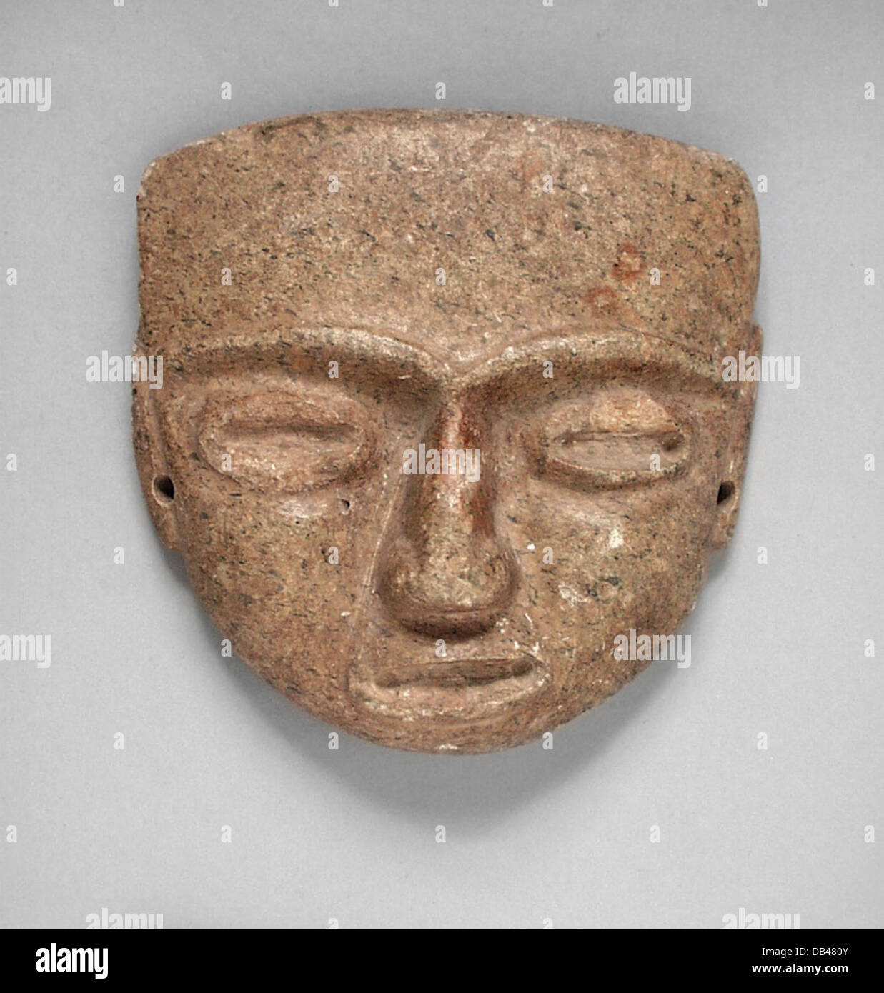 This mask, crafted from durable material, represents the traditional ...