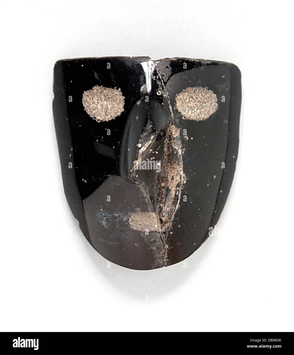 This mask, crafted from wood or similar materials, represents a key ...