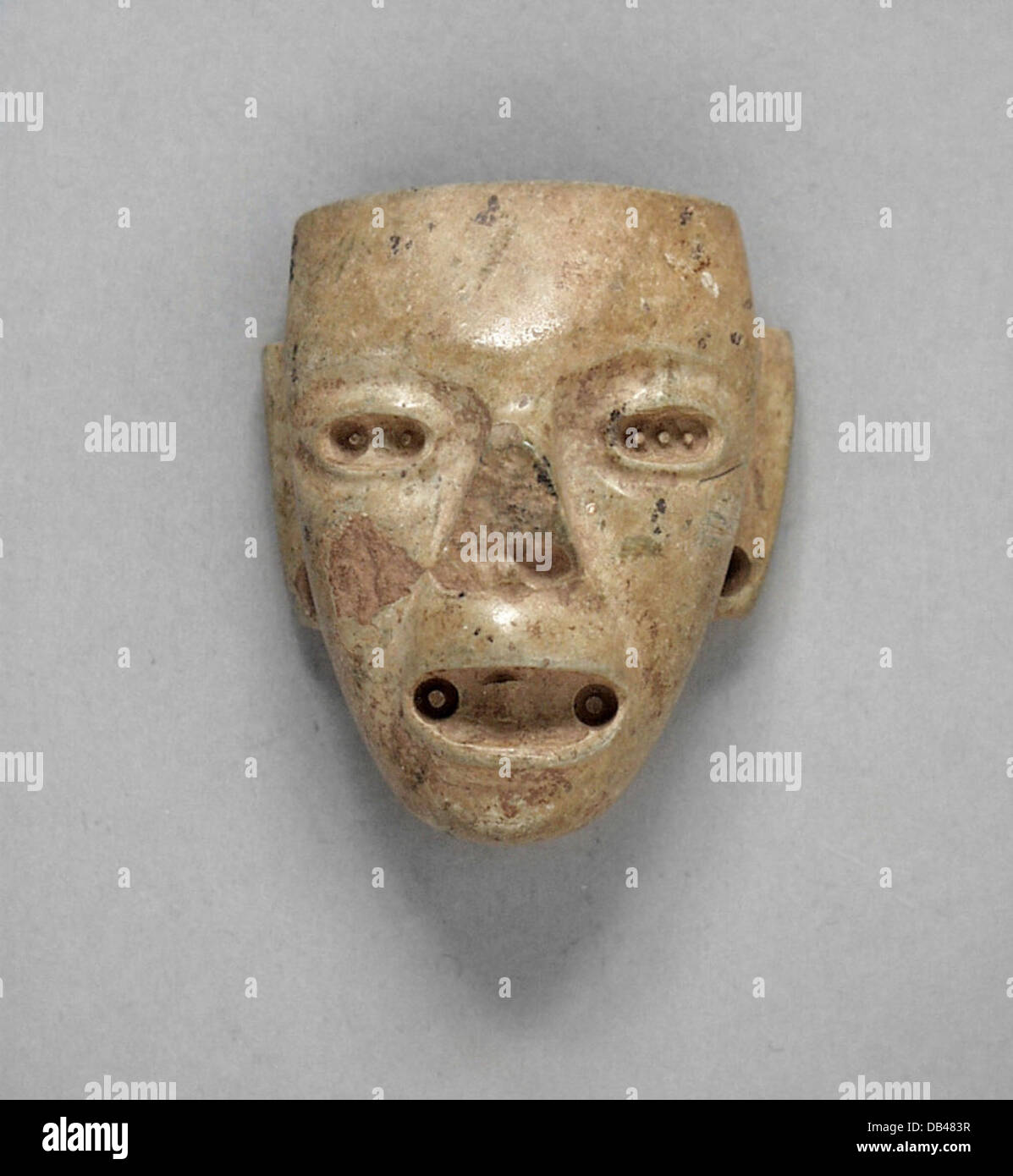 This ancient mask, part of the LACMA collection, is a bronze, cast ...