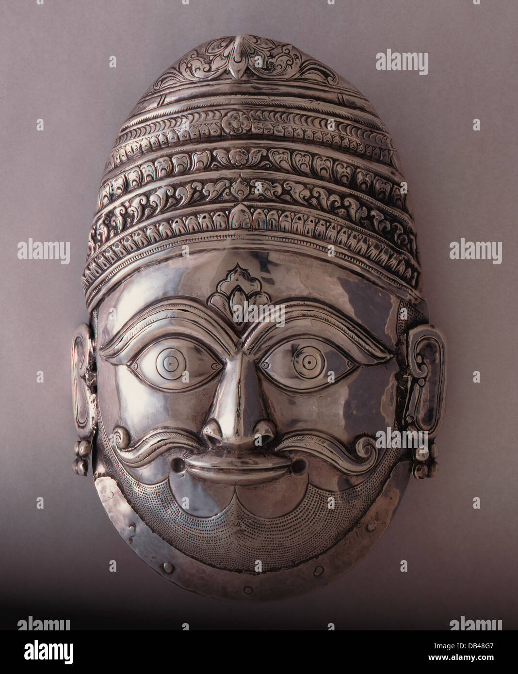 This mask represents the Hindu god Shiva, showcasing intricate ...