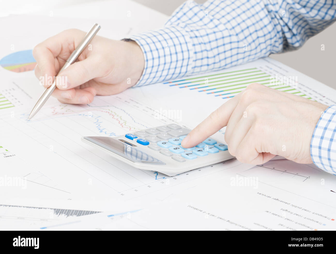 Business man busy with some financial calculations Stock Photo - Alamy