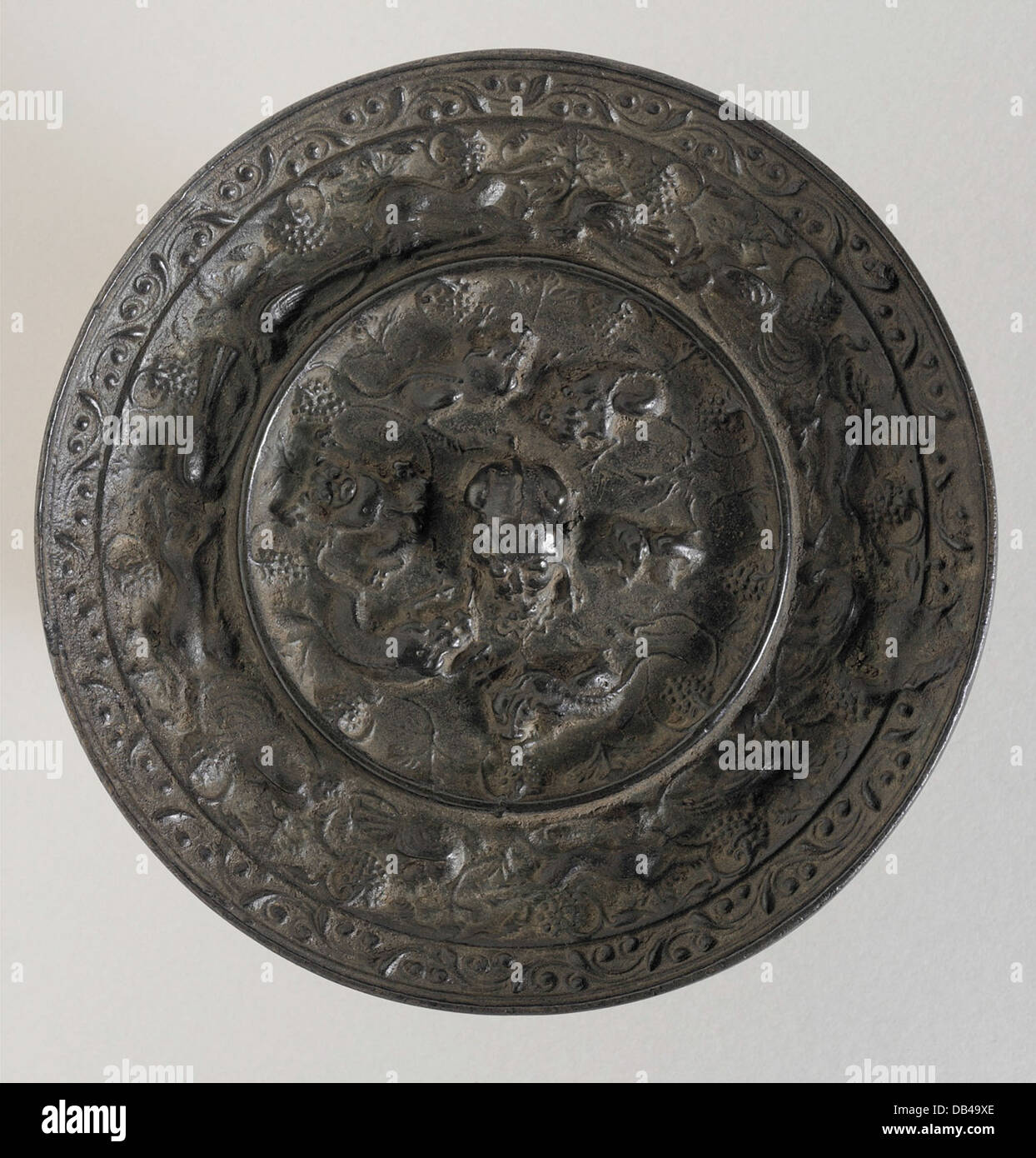This ancient Chinese mirror features intricate engravings of lions and ...