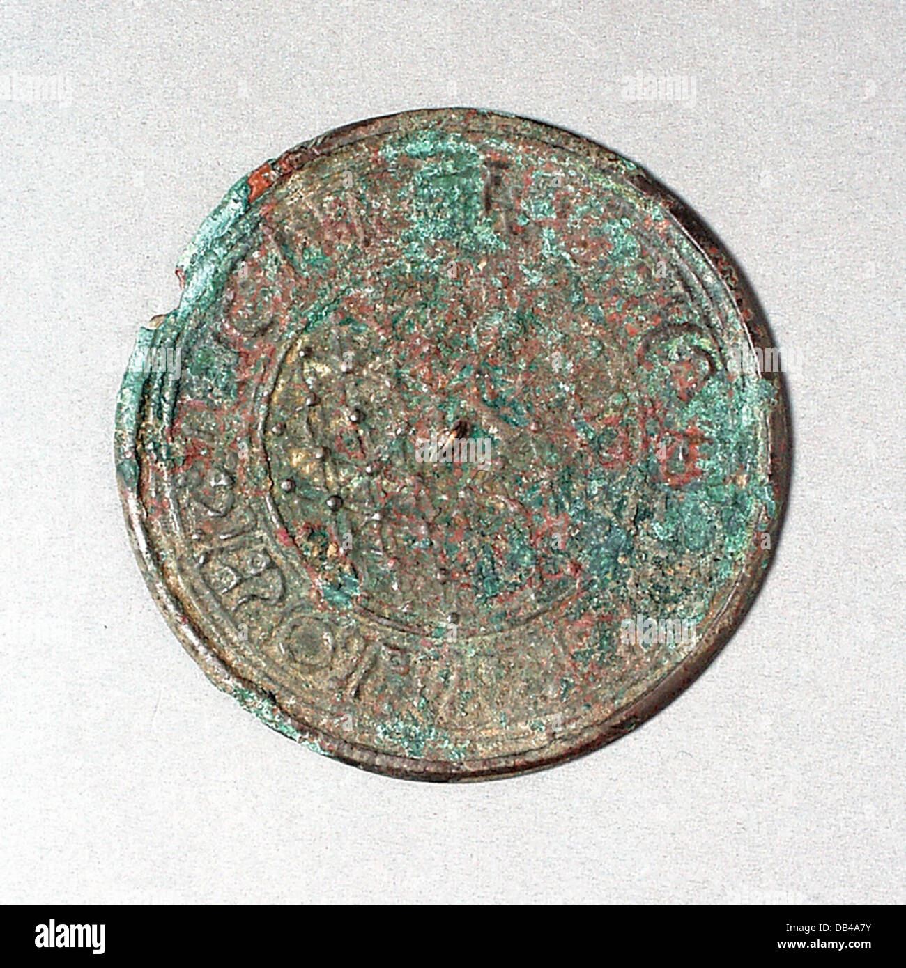 This mirror, crafted from polished metal, exemplifies both functional ...