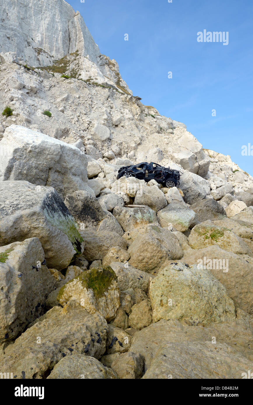 Aftermath of tragedy - the remains of a vehicle lie high on a cliff ...