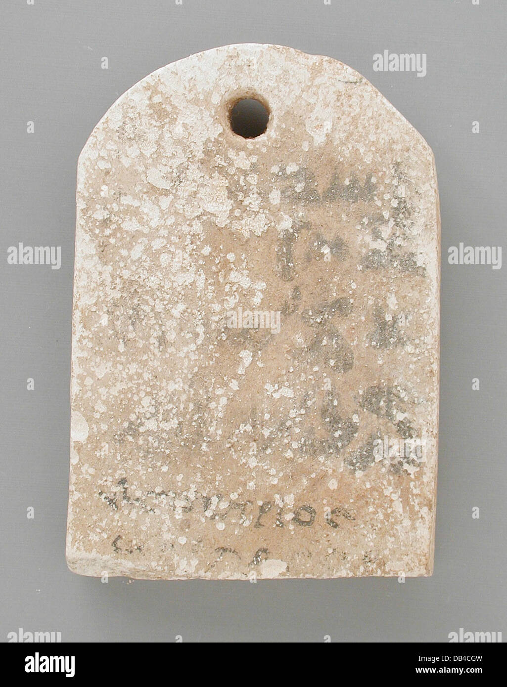 This mummy label, featuring inscriptions in Demotic and Greek, was used ...