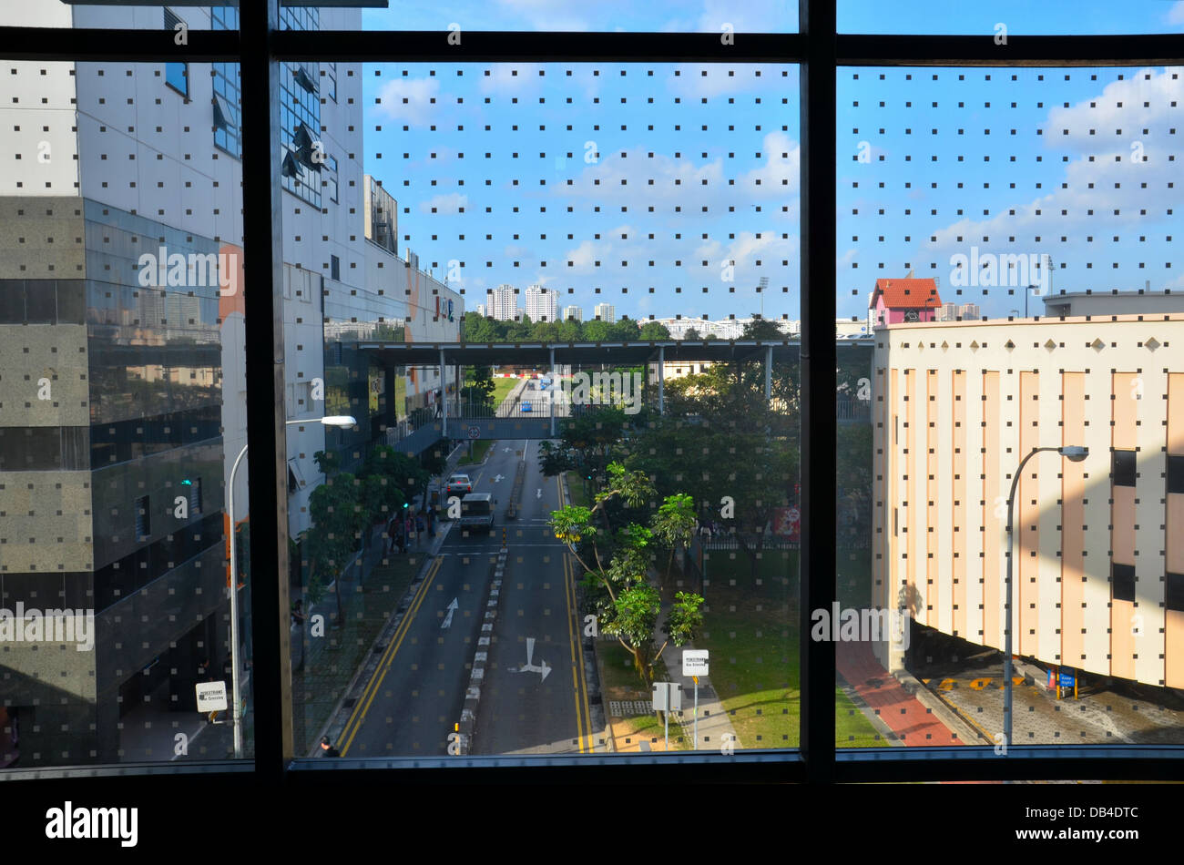 Singapore street scene through dotted glass window Stock Photo - Alamy