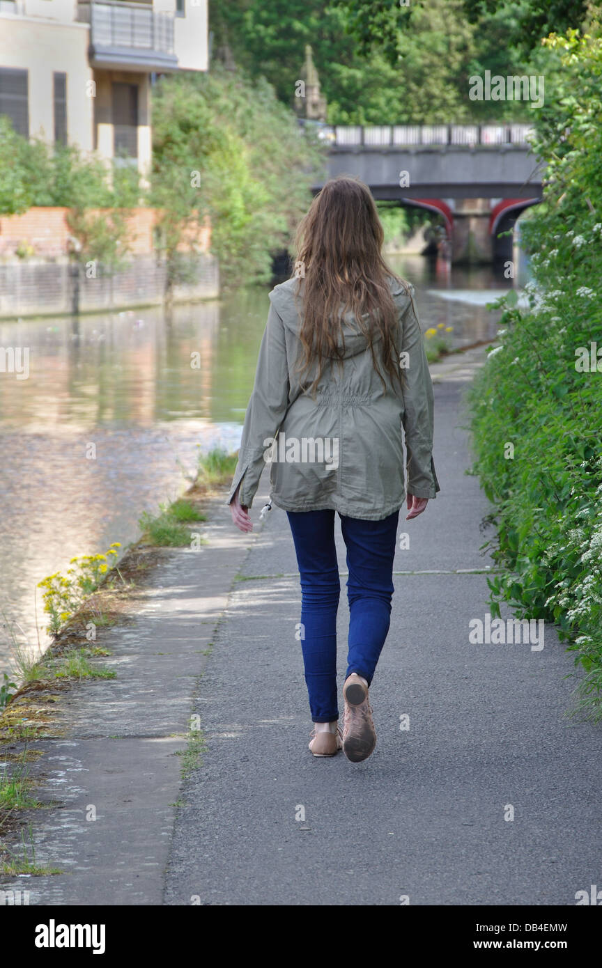 Woman walking alone hi-res stock photography and images - Alamy