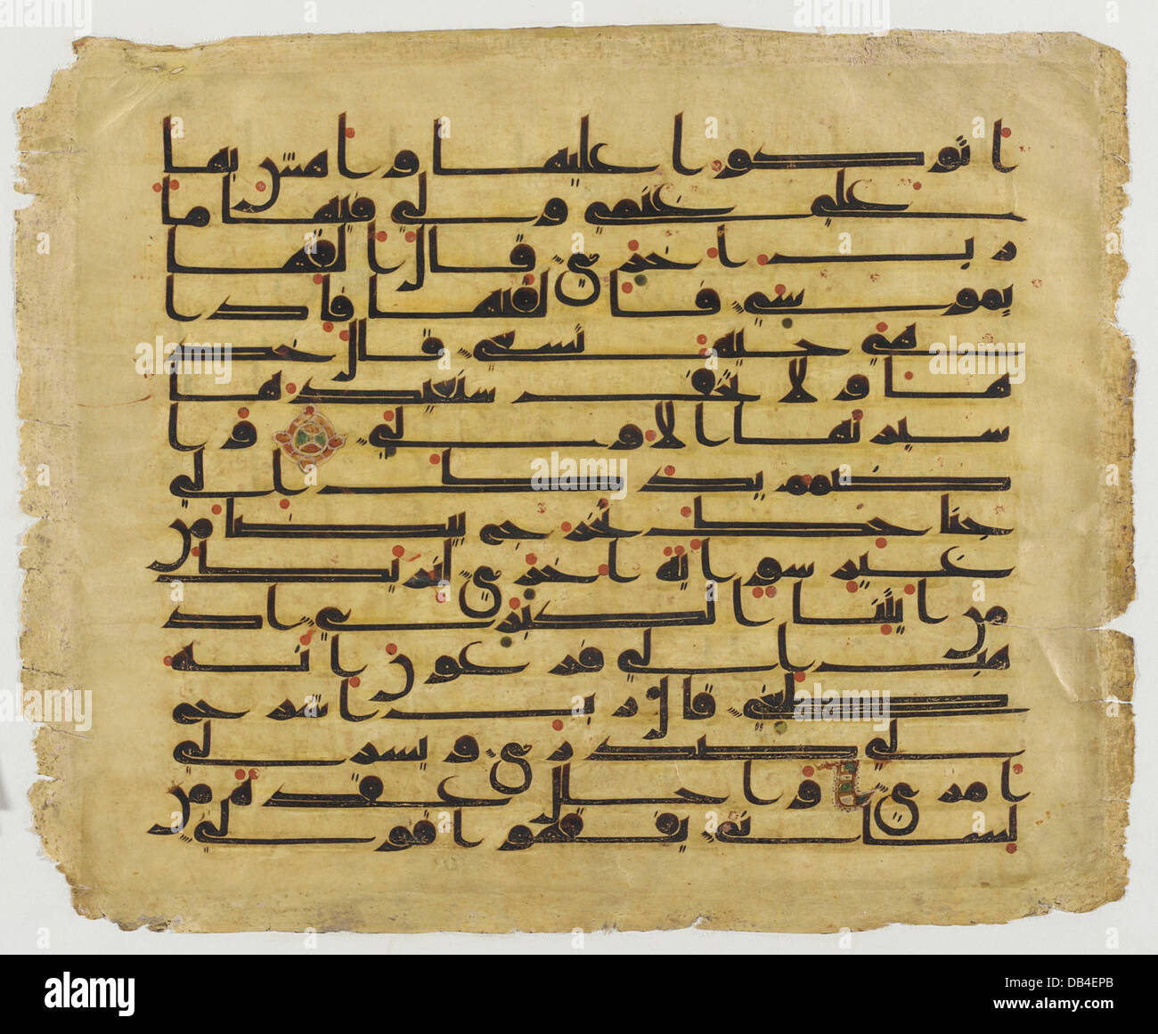 This page from a Qur'an manuscript features intricate calligraphy and ...