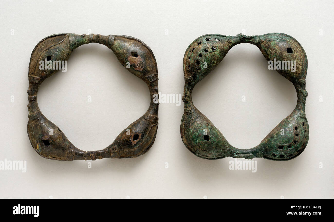 A pair of intricately designed anklets from ancient Egypt, cast in ...