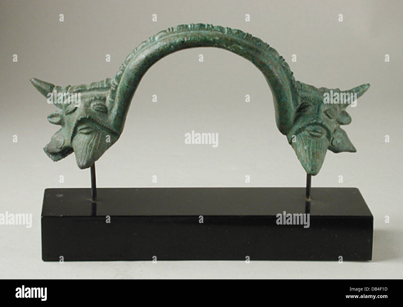 These bronze handles feature the masks of Achelous, a figure from Greek ...