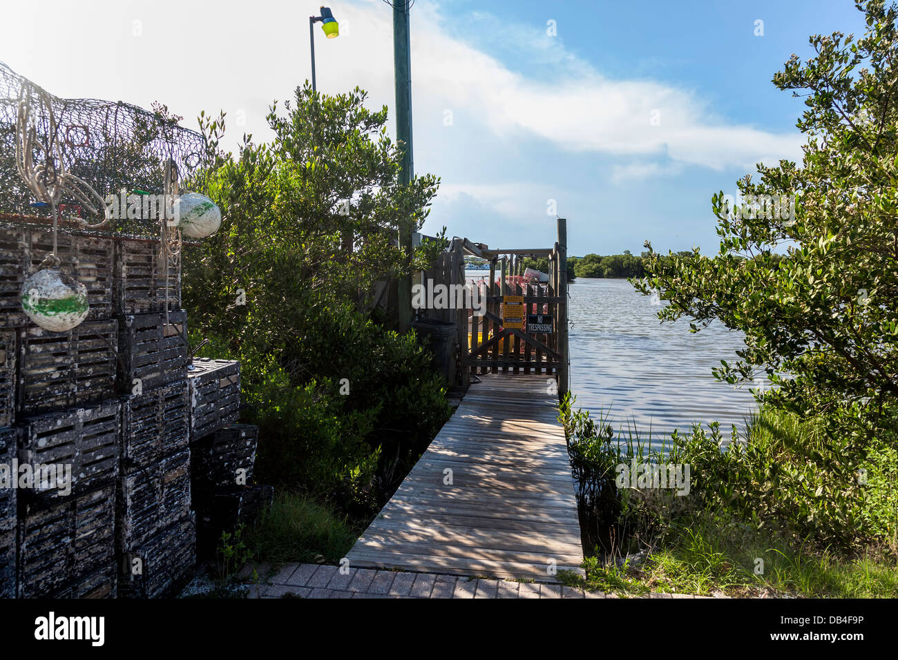 Wooden deck leads to a boat dock or pier wharf with gate in Cedar Key ...