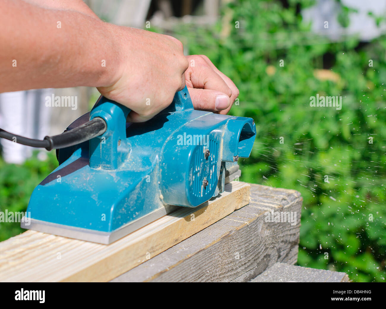 Handyman using polish machine outdoors Stock Photo - Alamy