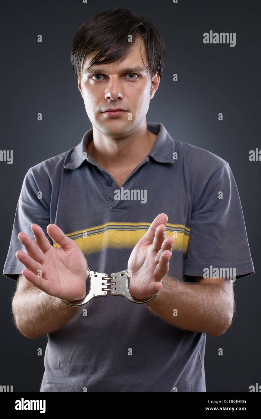 Handcuffed man hi-res stock photography and images - Alamy