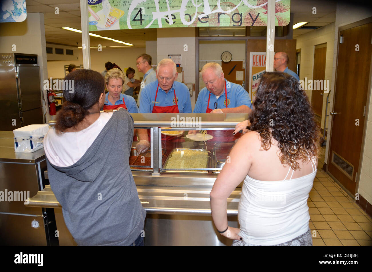2 teenage girls get served lunch in a high school cafeteria Stock Photo ...
