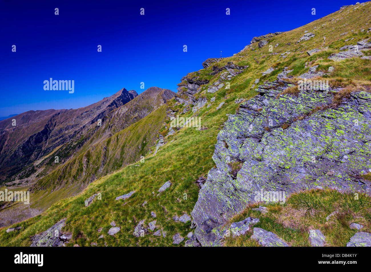 Landscape with mountain trail and clear blue sky Stock Photo - Alamy