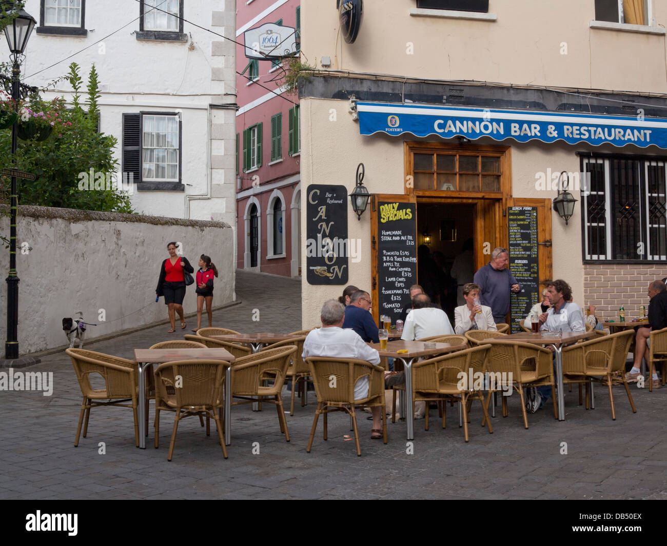 People sit outside in a British pub in the old town in Gibraltar Stock ...