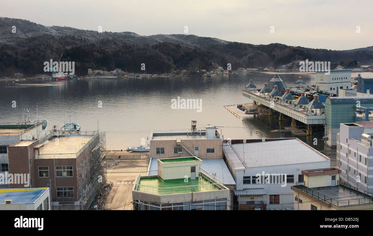 Aerial high angle view of Kesennuma city and its fishing port revealing ...