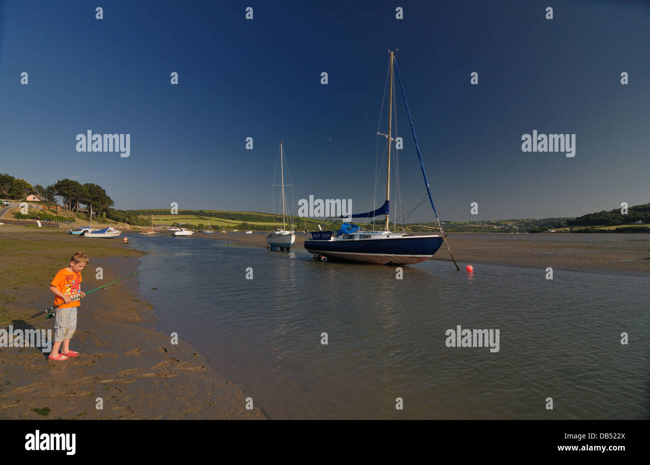 young boy age 8 fishing river teifi gwbert west wales Stock Photo - Alamy