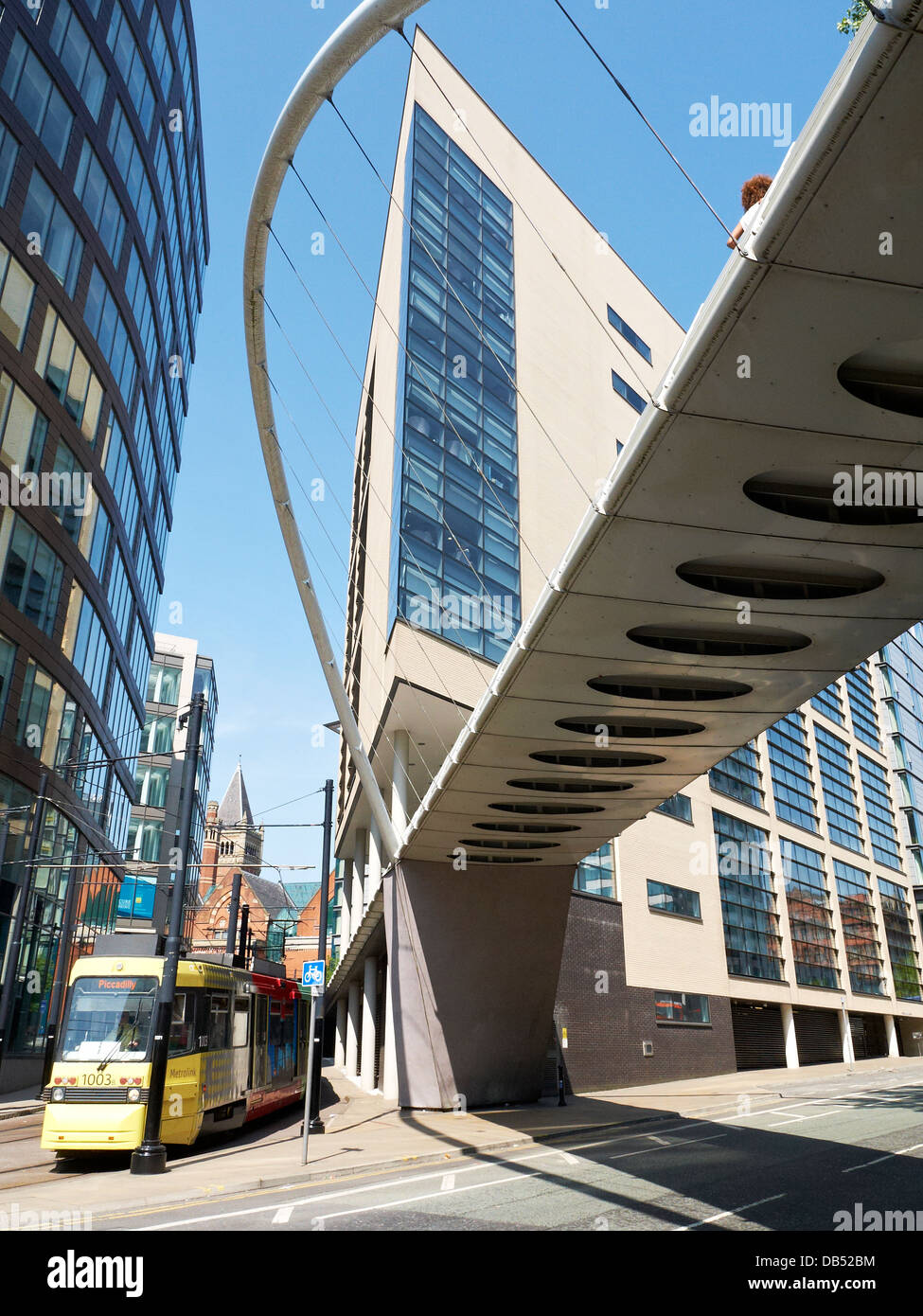 Pedestrian bridge over London Road with tram in city centre of ...