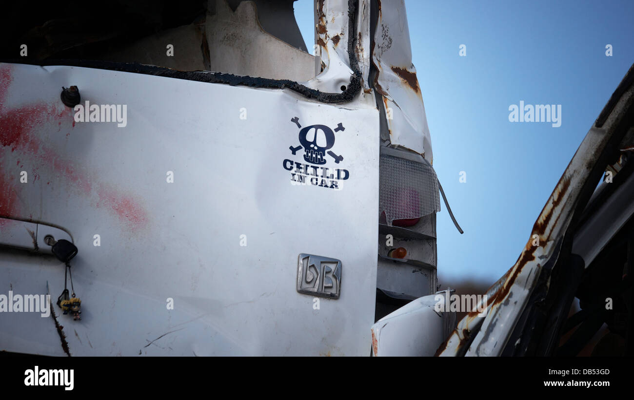 A private car with a child in car decal totally smashed by the 2011 ...