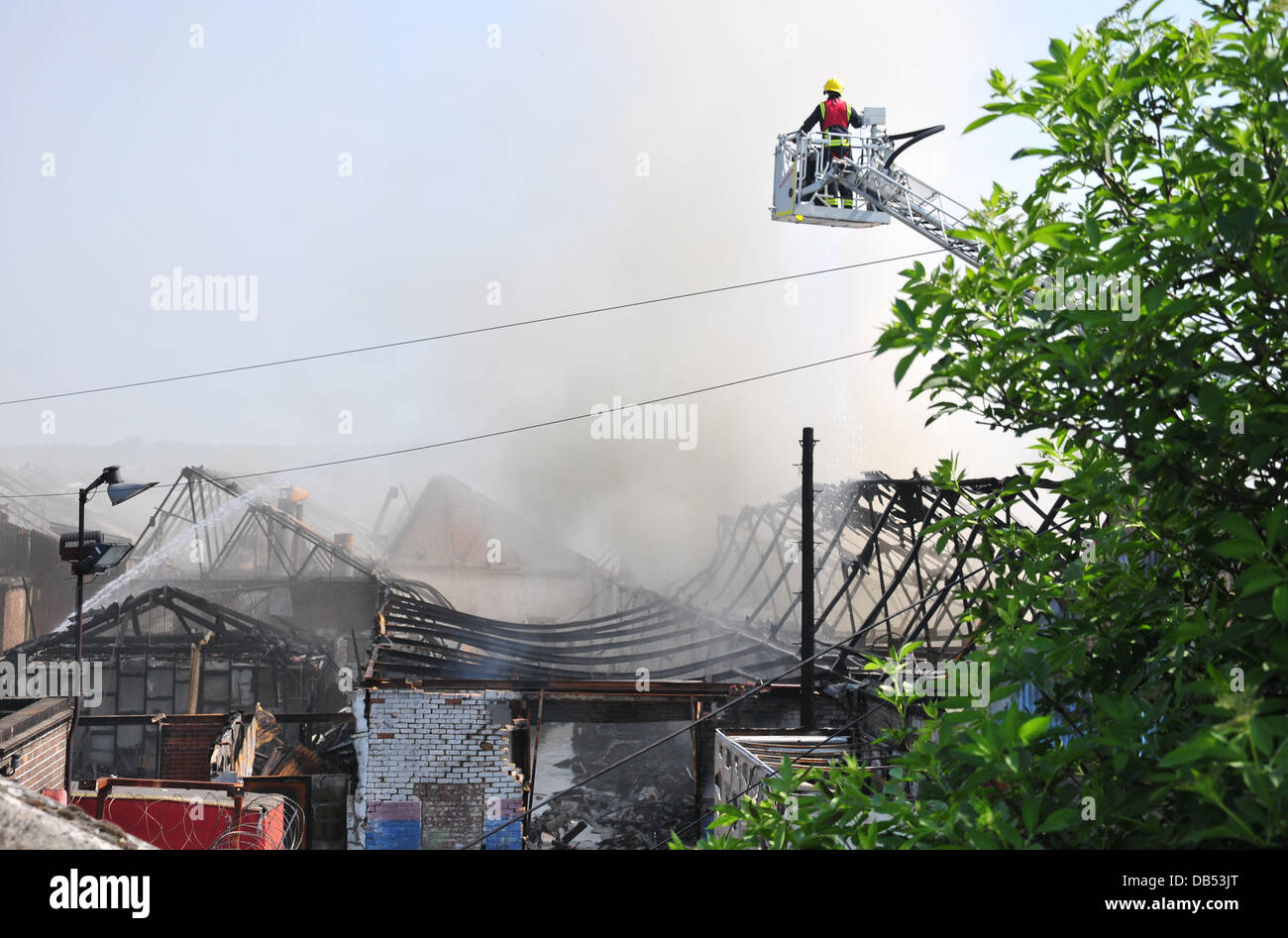 Firefighters are still battling a fire blazing across warehouses which ...