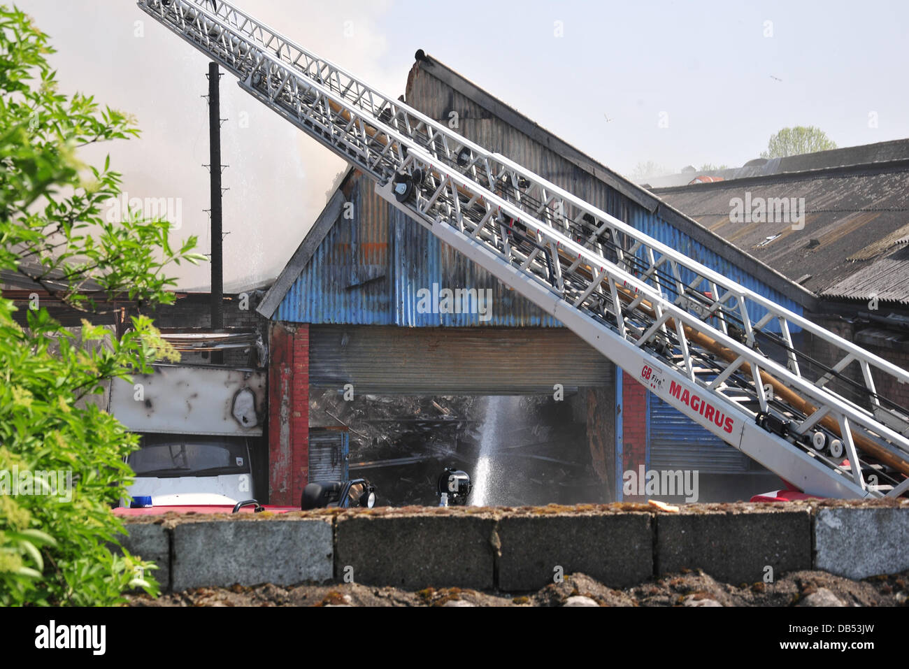 Firefighters are still battling a fire blazing across warehouses which ...