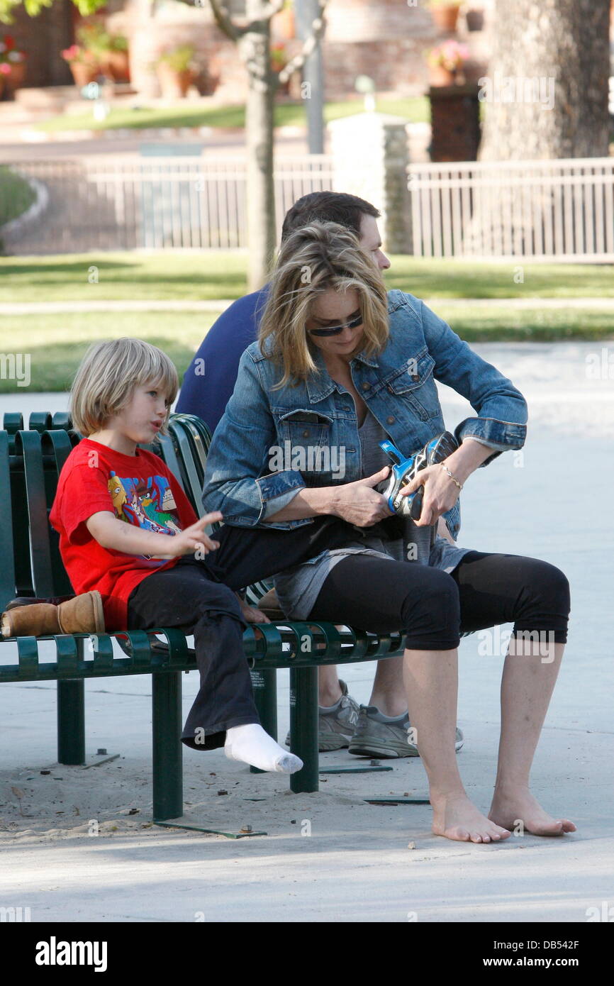 Sharon Stone Helps to put her son Quinn Stone's shoes back on at a park ...