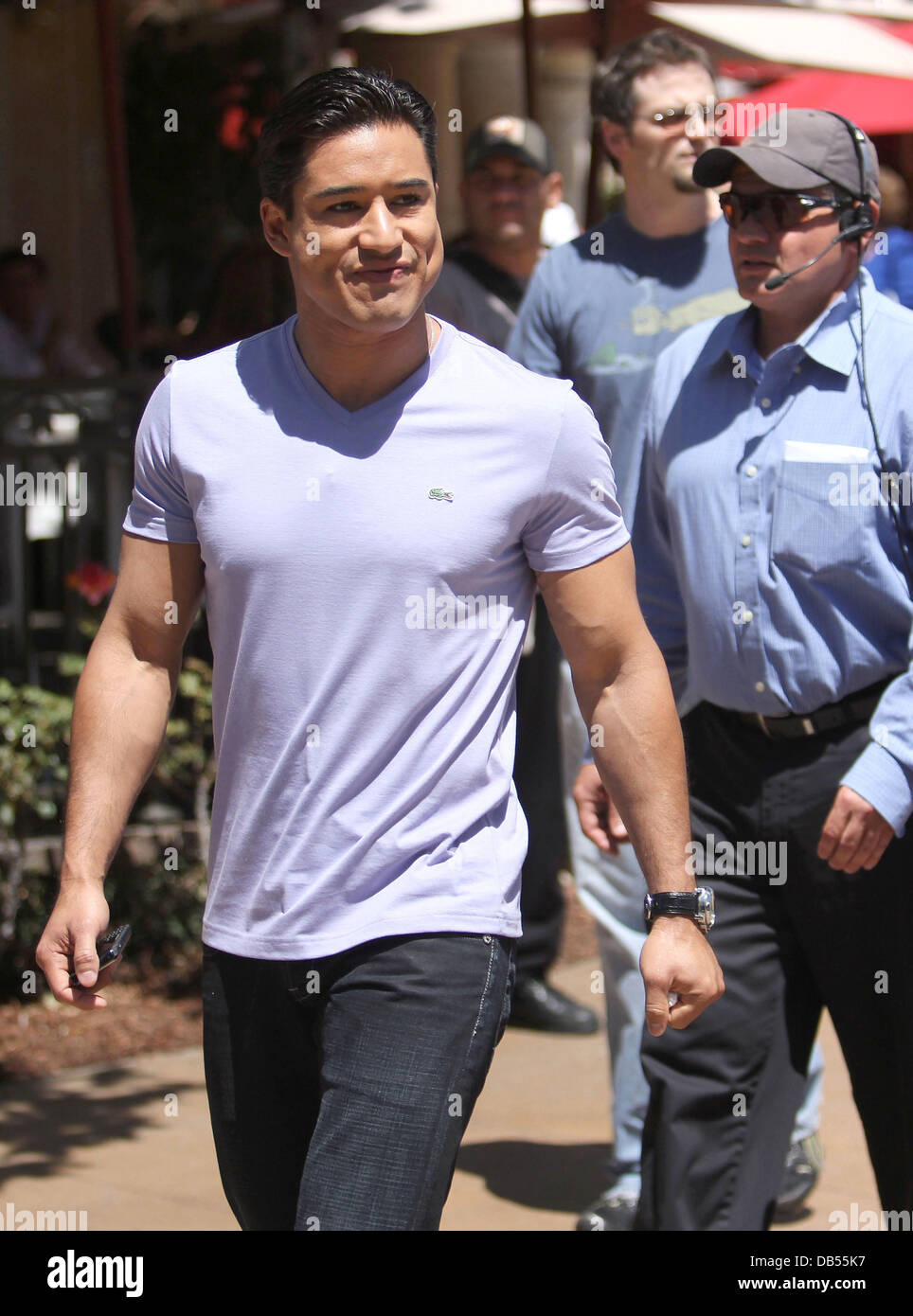 Mario Lopez filming an interview for entertainment television news ...