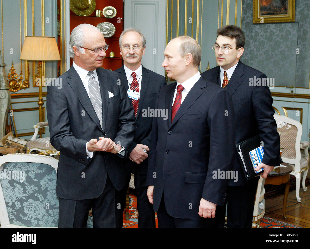 Carl XVI Gustaf of Sweden greets Russian Prime Minister Vladimir Putin ...