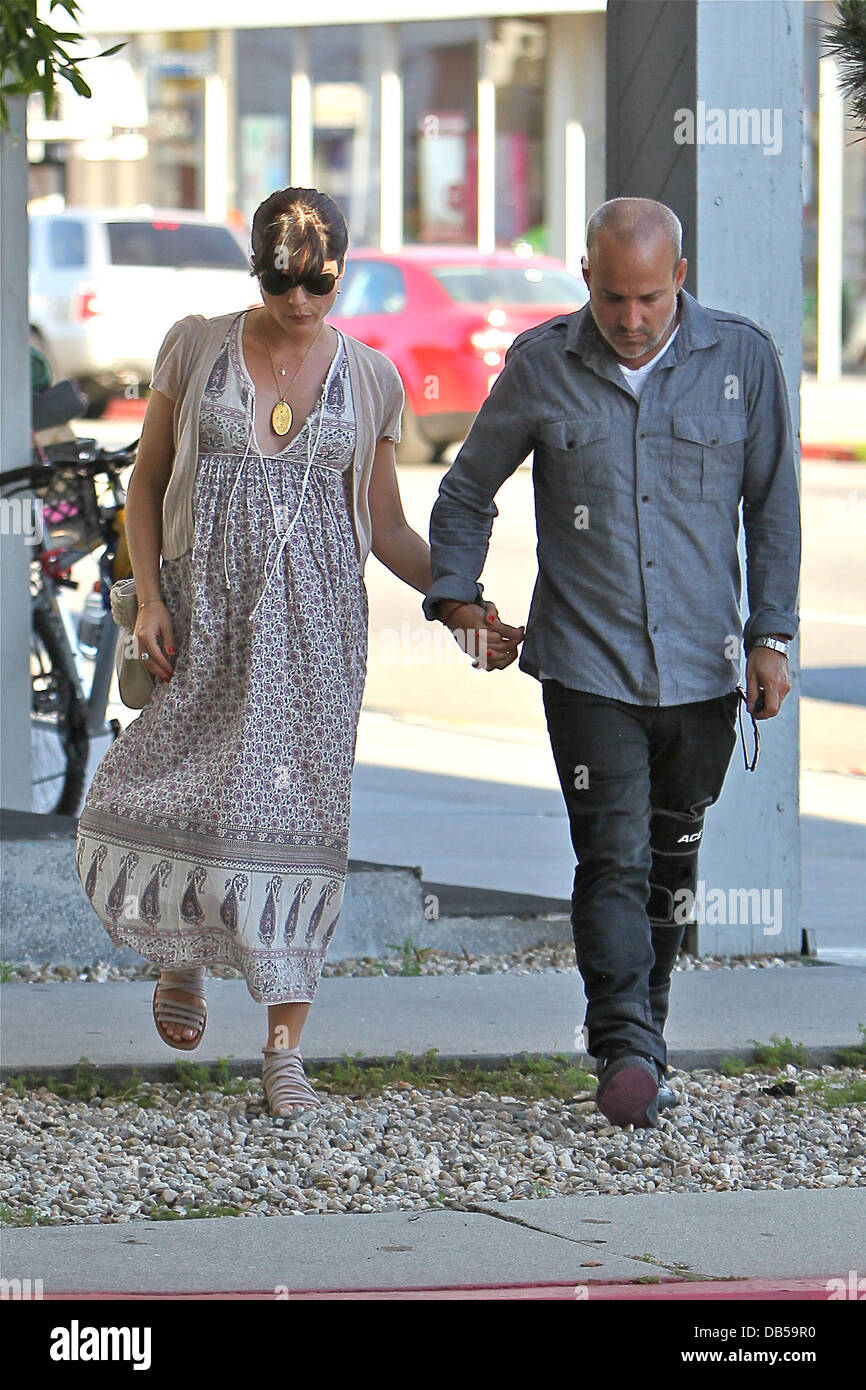Heavily pregnant Selma Blair in a floral-print dress and sandals with ...