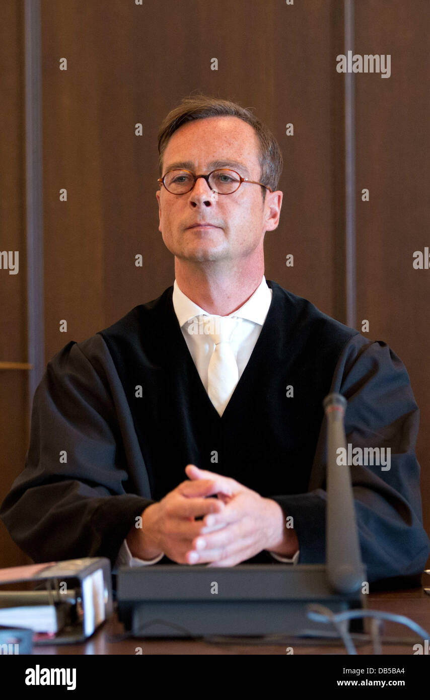 Hamburg, Germany. 24th July, 2013. Judge Mark Tully opens the trial ...