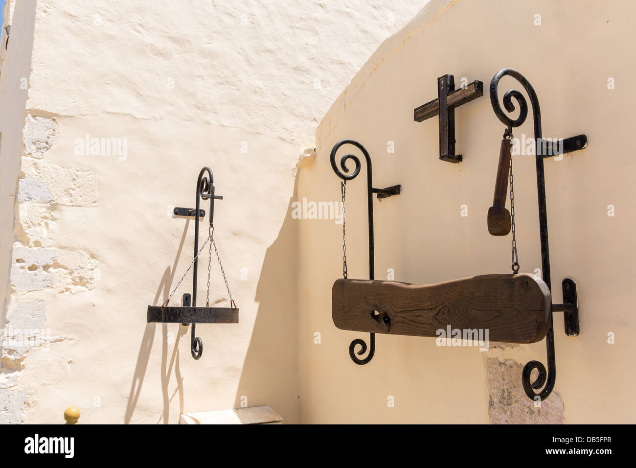 Greek religious symbol,cross,plaque with the name on wall of monastery ...