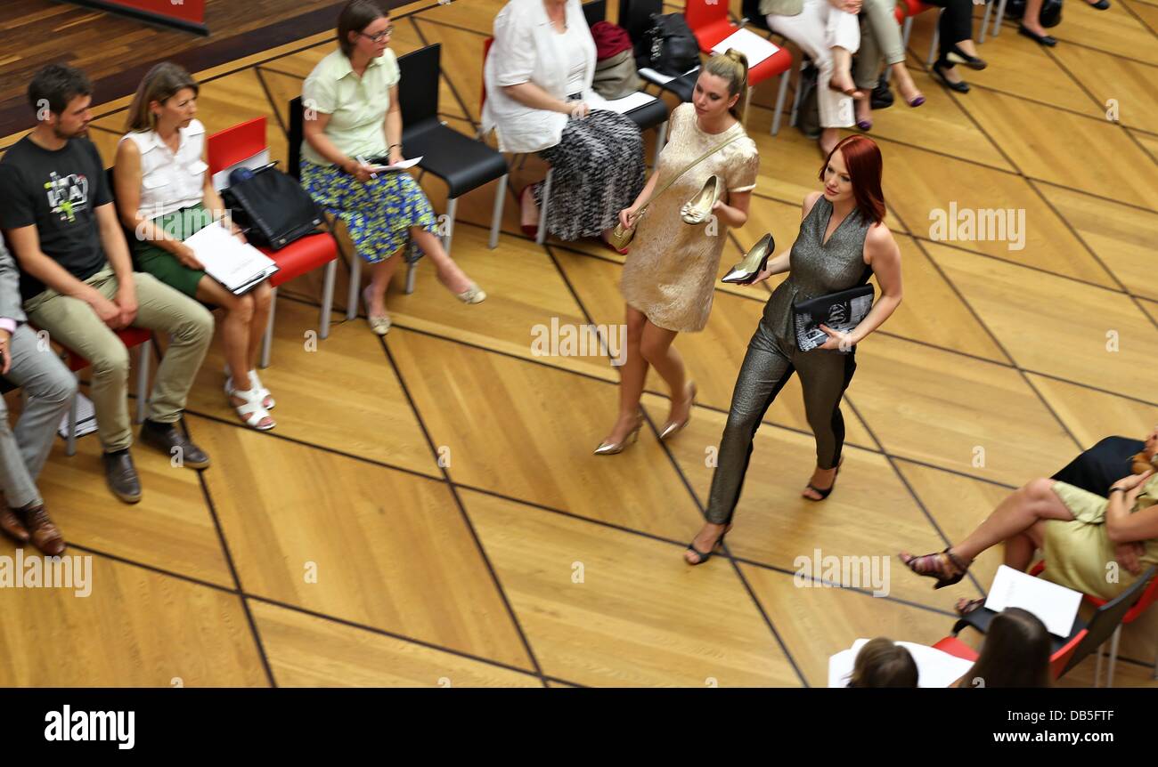 Leipzig, Germany. 24th July, 2013. Models present women's shoes in ...